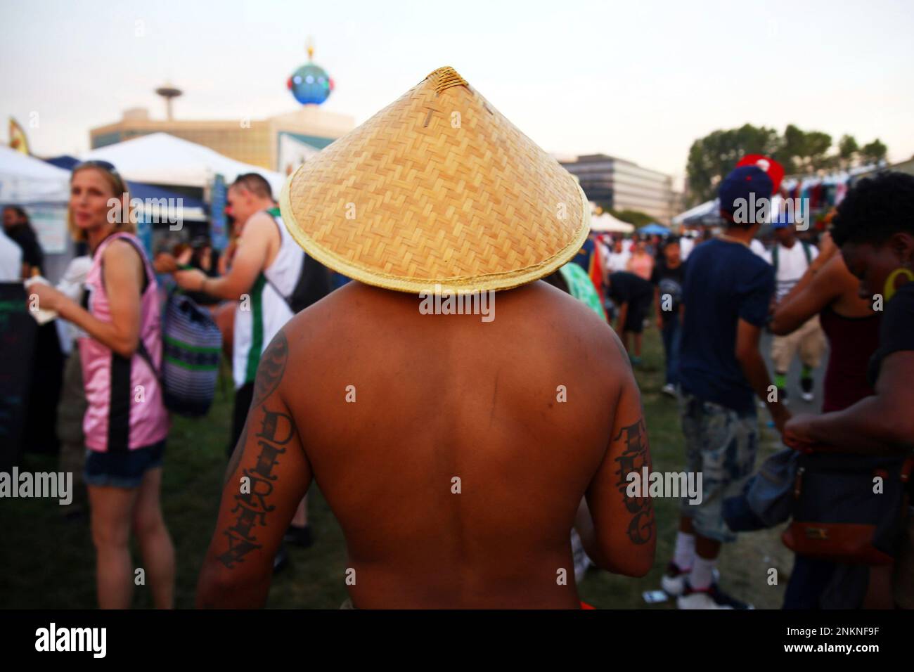 A man makes his way through the crowd on day two of Hempfest, the ...