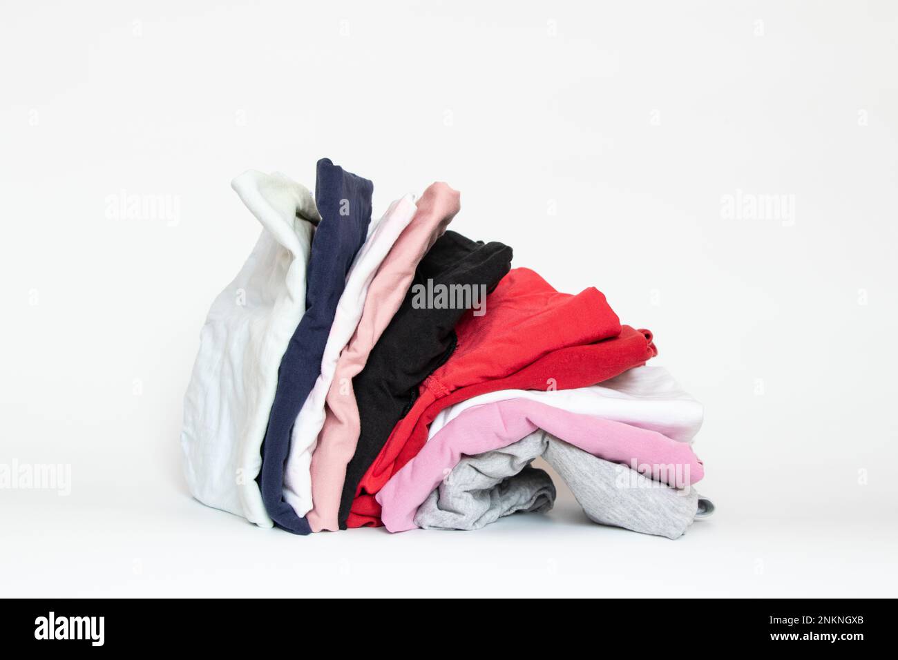 A stack of folded things on a white background close up, a lot of ...