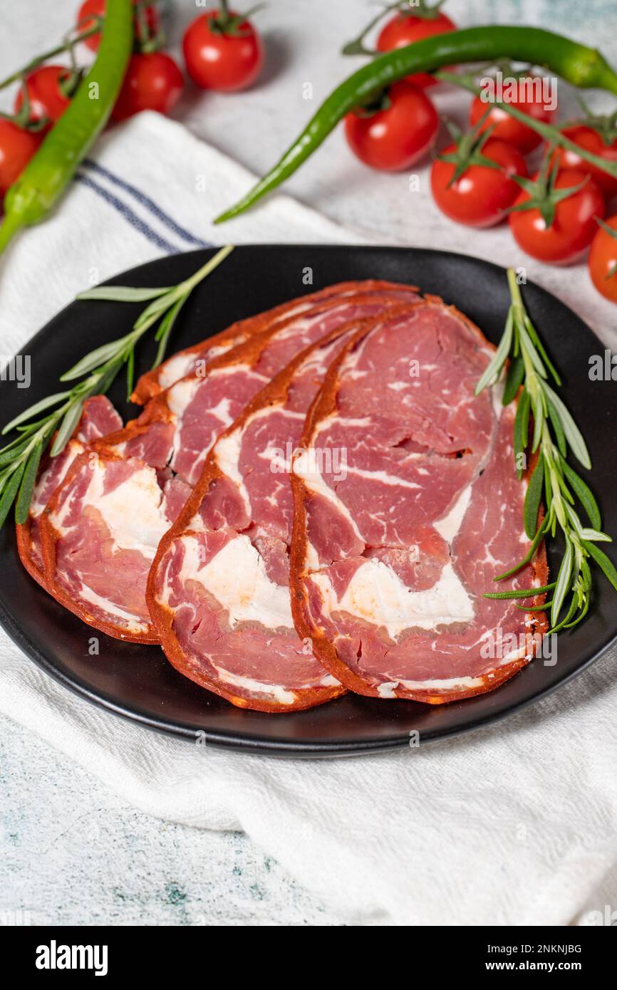 Beef ribeye bacon. Dried Turkish pastrami slices in plate. Traditional ...