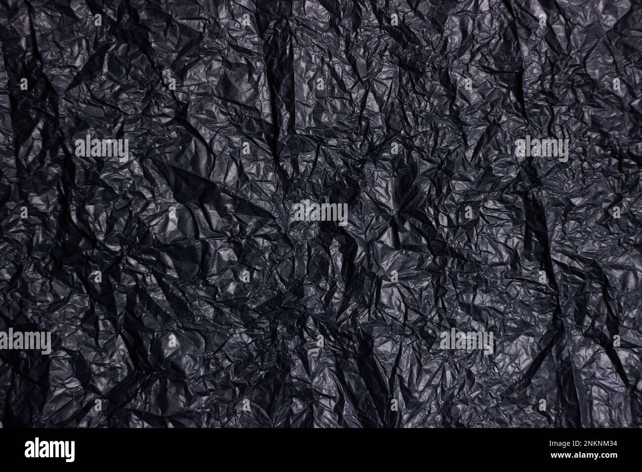 Abstract background of black crumpled satin paper Stock Photo - Alamy