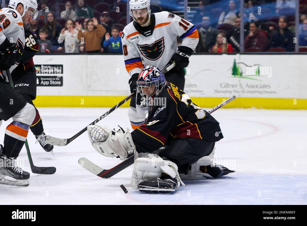 CLEVELAND, OH - FEBRUARY 26: The puck deflects off the pad of Cleveland ...