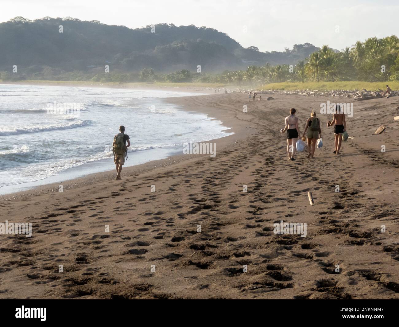 People walking along a beach near Samara in Costa Rica Stock Photo - Alamy