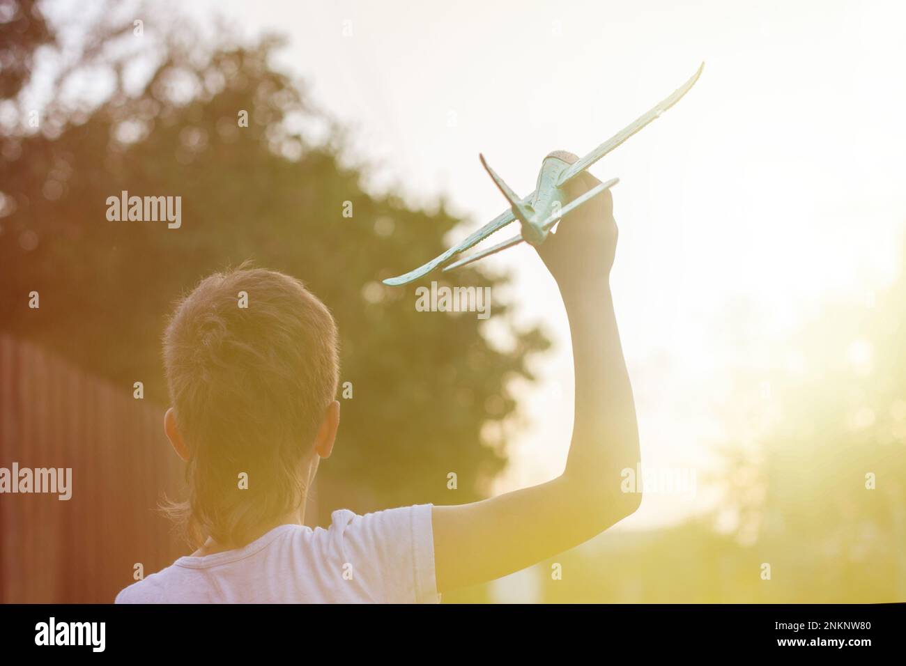 Happy child boy playing with toy airplane outdoor Stock Photo - Alamy