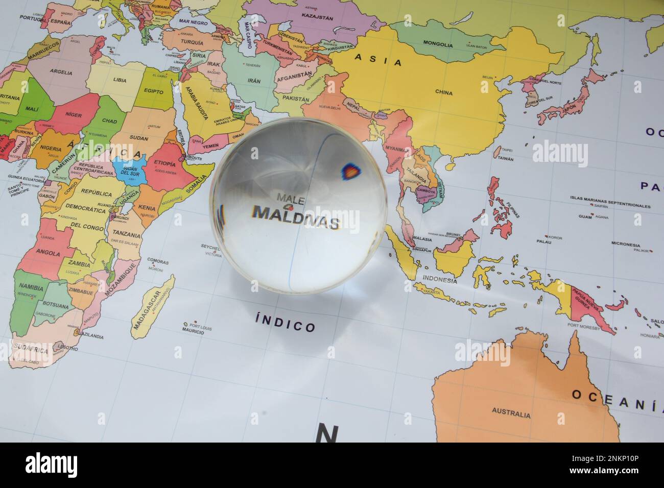 Crystal ball on a world map that highlights a country to highlight it ...