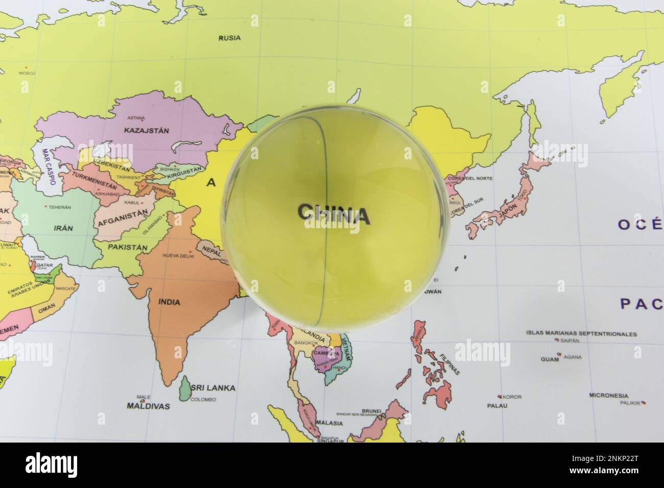 Crystal ball on a world map that highlights a country to highlight it ...
