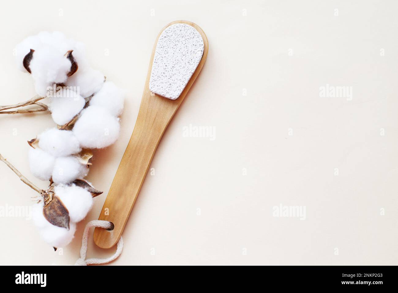 eco friendly foot pumice stone and cotton flower on beige background ...