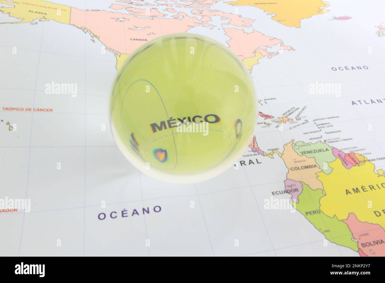 Crystal ball on a world map that highlights a country to highlight it ...