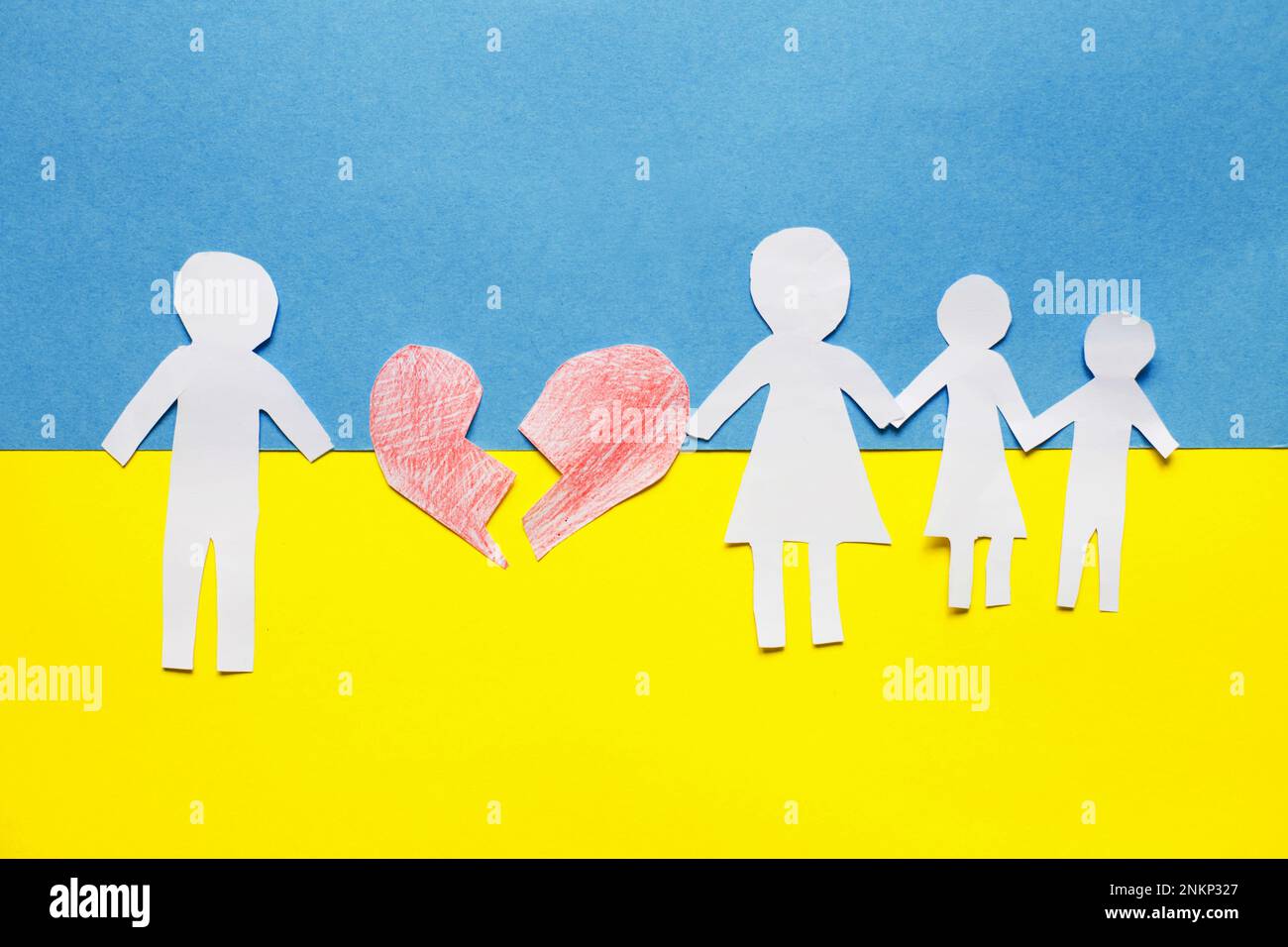 paper cut divided family on the background of the ukrainian flag. stop ...
