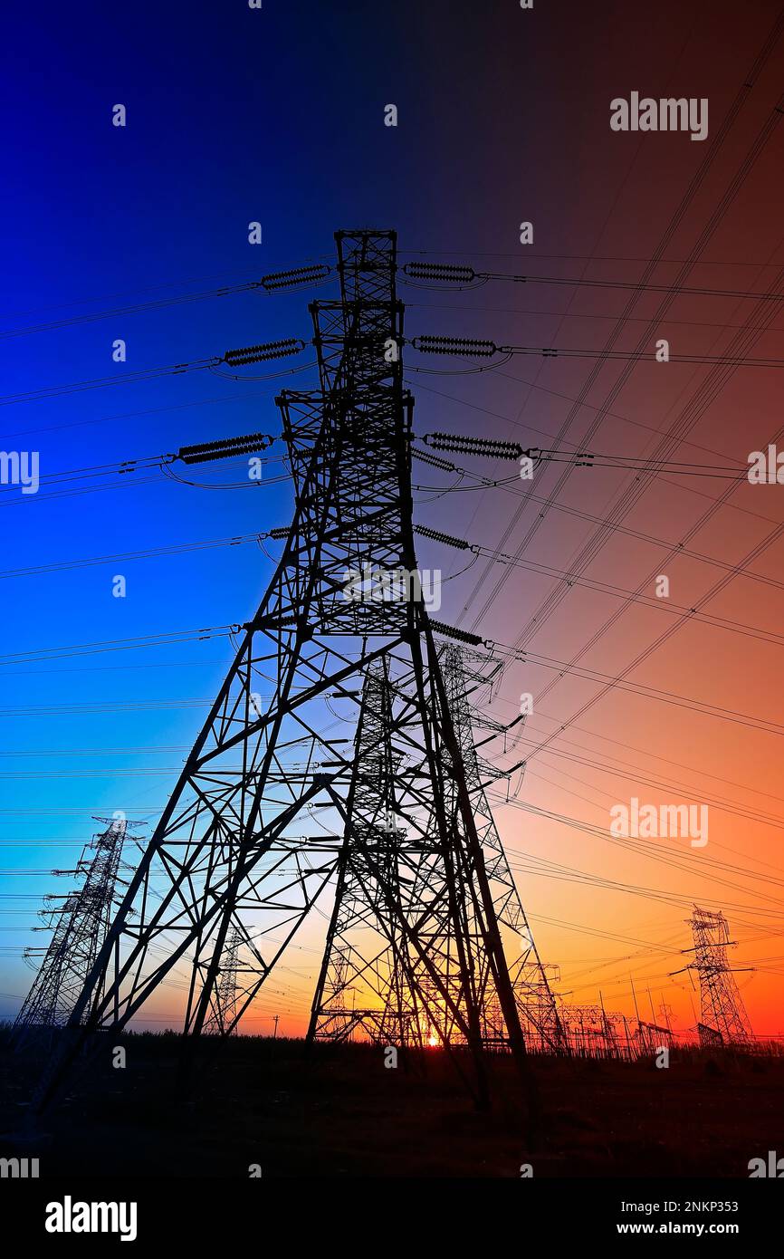 Sunset silhouette of pylon Stock Photo - Alamy