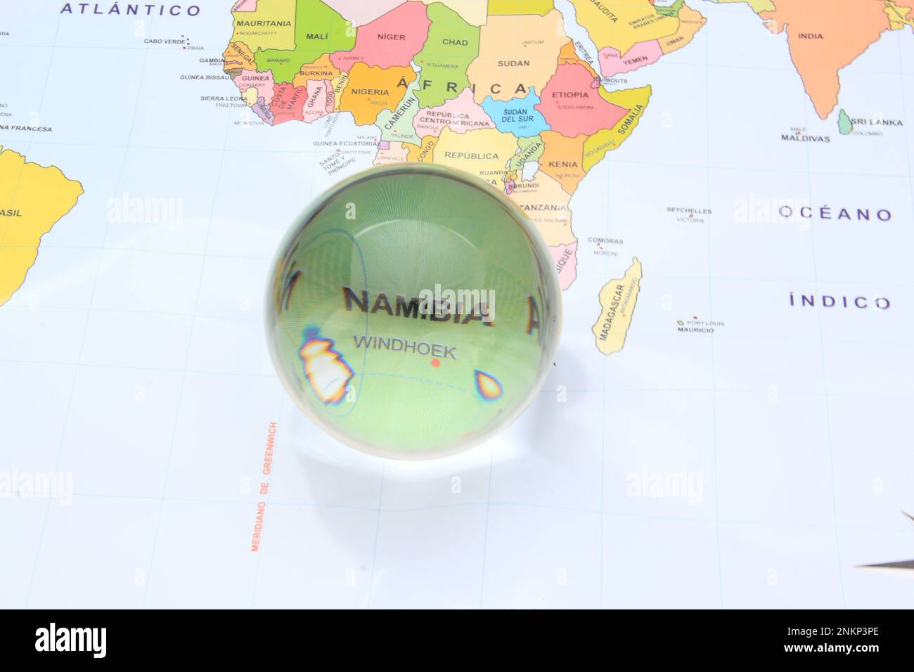 Crystal ball on a world map that highlights a country to highlight it ...