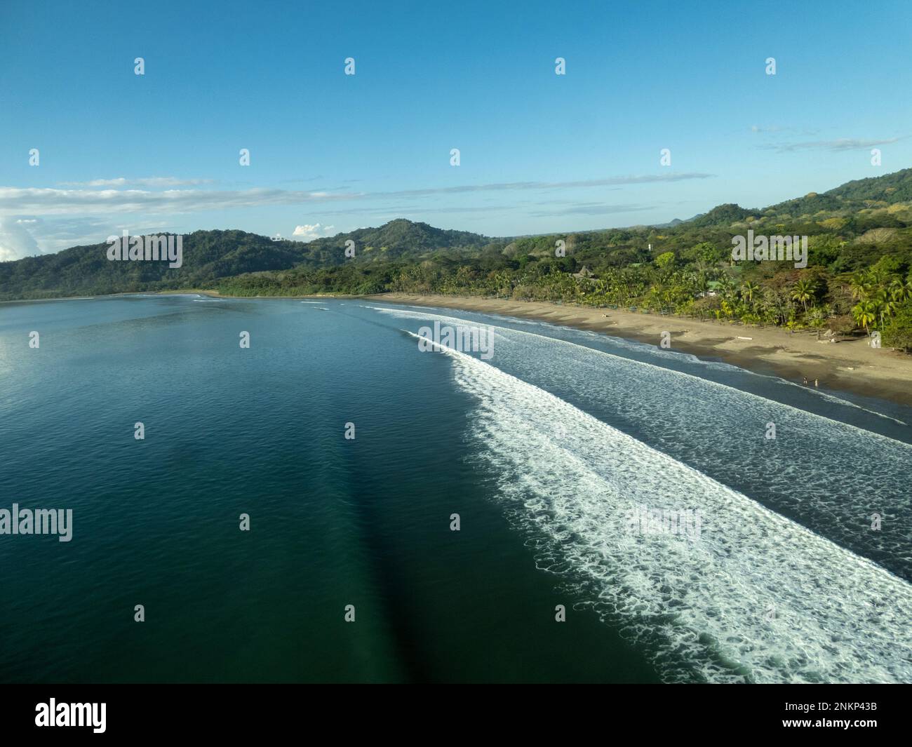 An ariel view of the sea and sets of waves rolling in towards Tambor ...