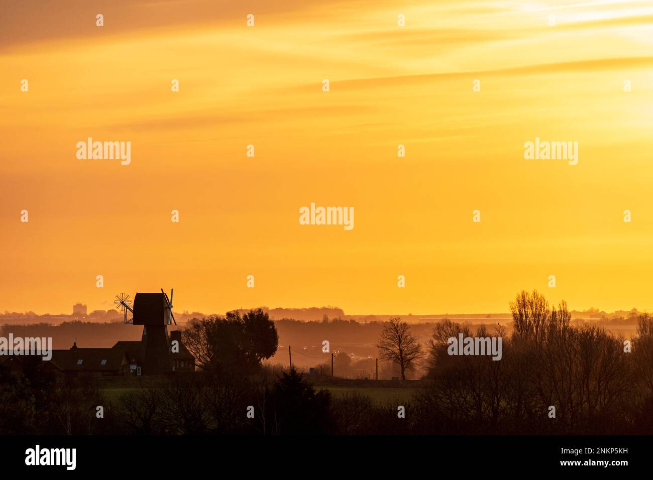 Orange dawn sky over the Kent landscape at Chislet in the winter ...