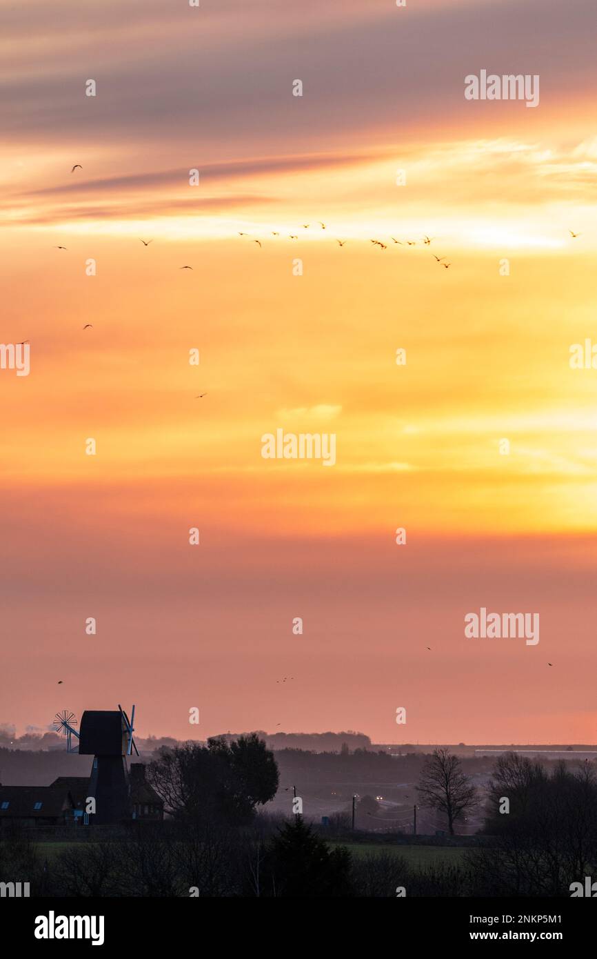 Orange dawn sky over the Kent landscape at Chislet in the winter ...