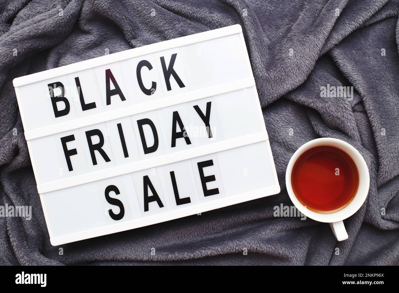 friday sale announcement on a writing box on grey textile plush fabric ...