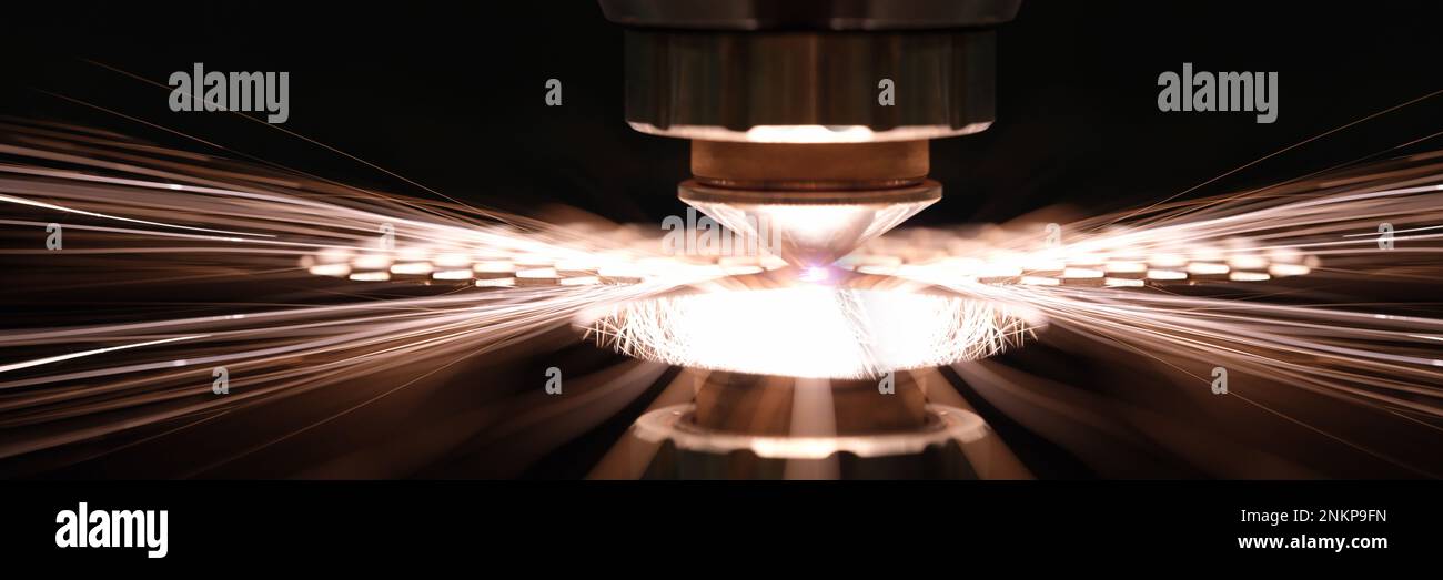 Industrial laser cutter sparks close hi-res stock photography and ...