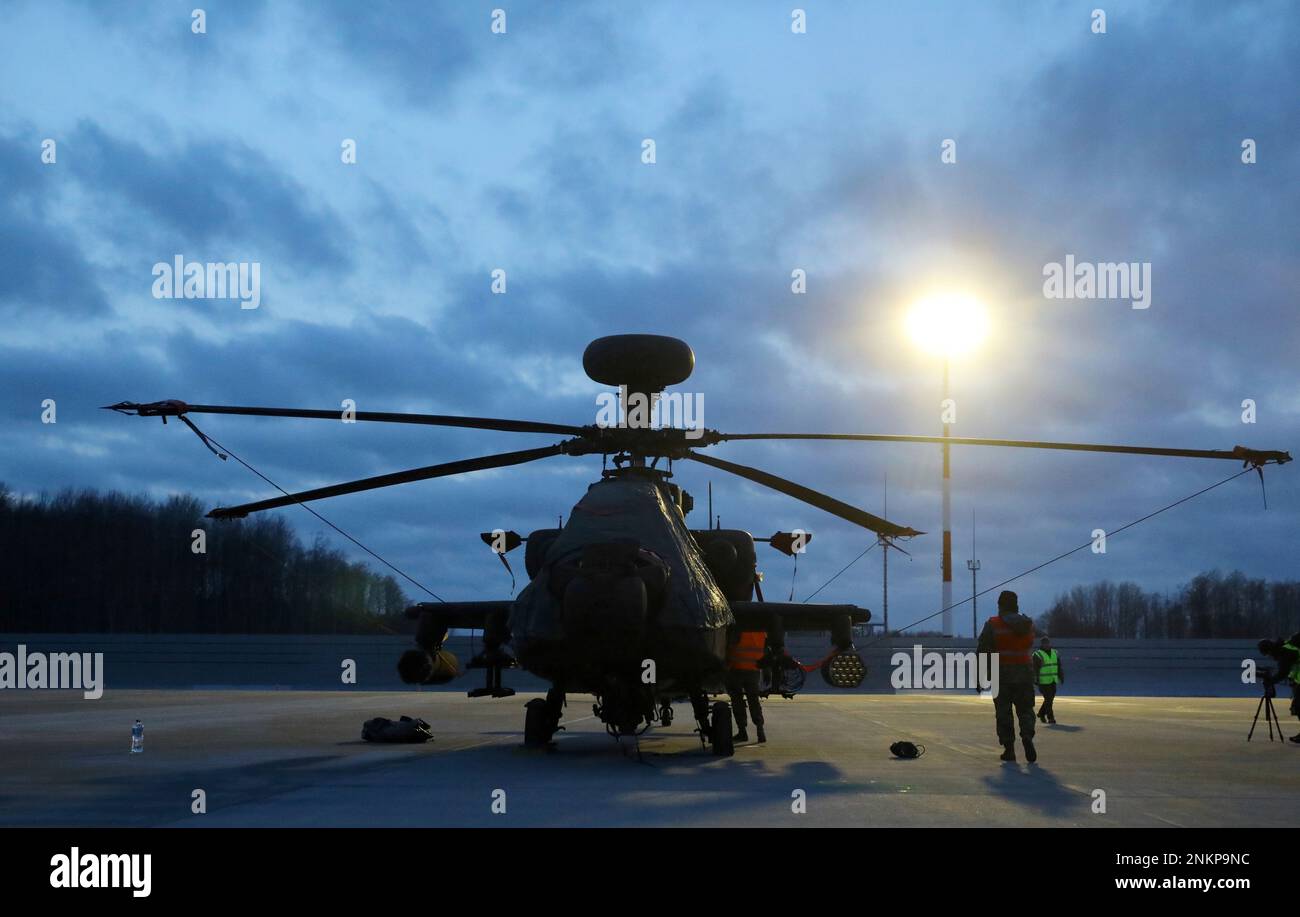 A U.S. Boeing AH-64 Apache attack helicopter is parked after landing at ...