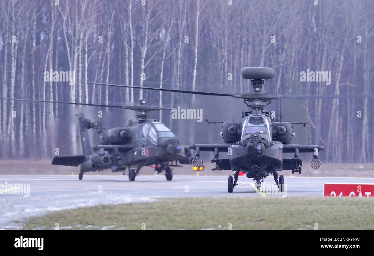 U.S. Boeing AH-64 Apache attack helicopters taxi after landing at the ...