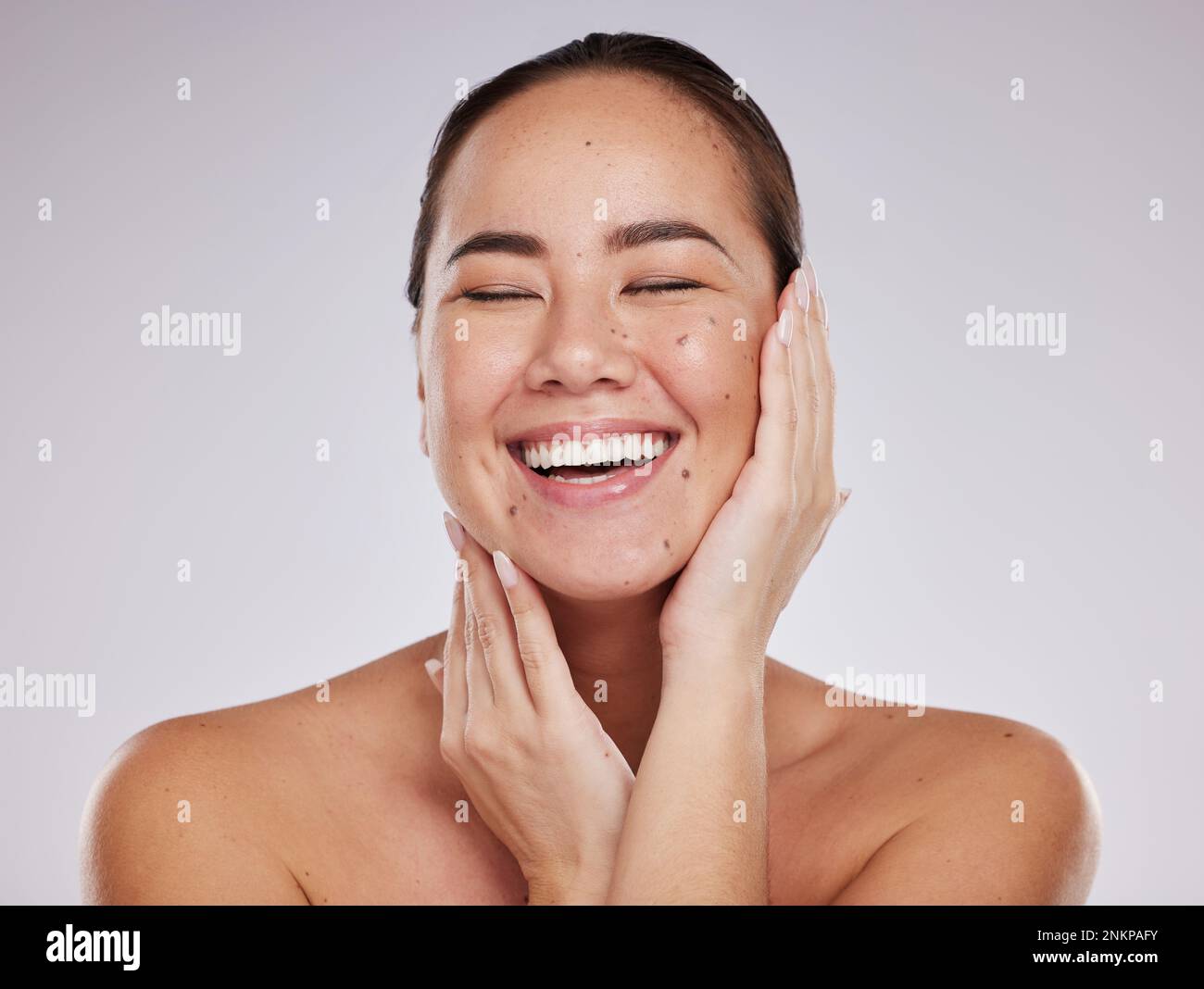 Skincare, hands on face and woman laughing in studio for cosmetics ...