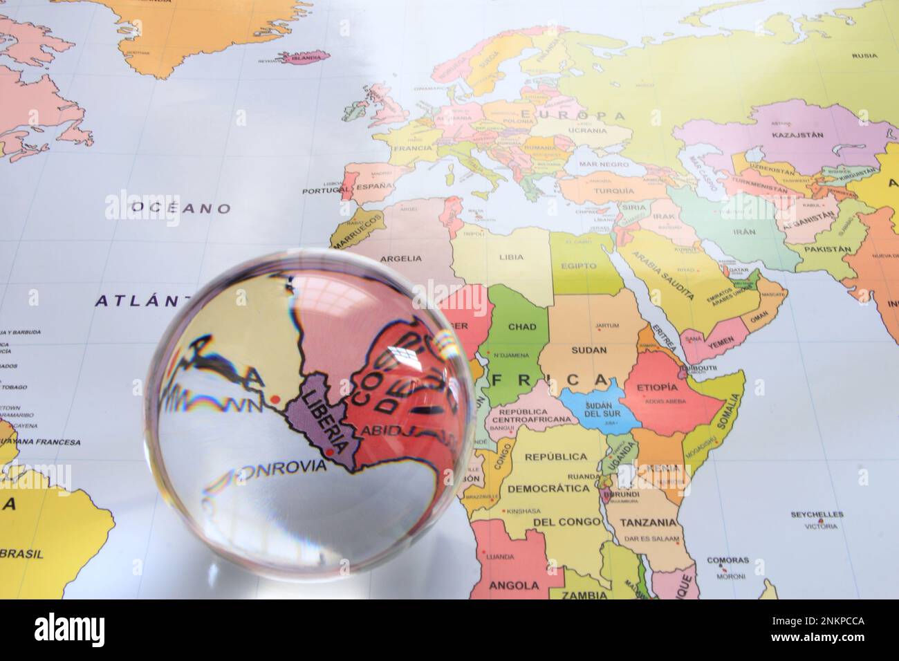 Crystal ball on a world map that highlights a country to highlight it ...