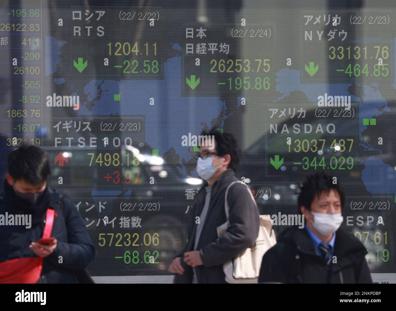 A monitor shows the 225-issue Nikkei Stock Average index price and ...