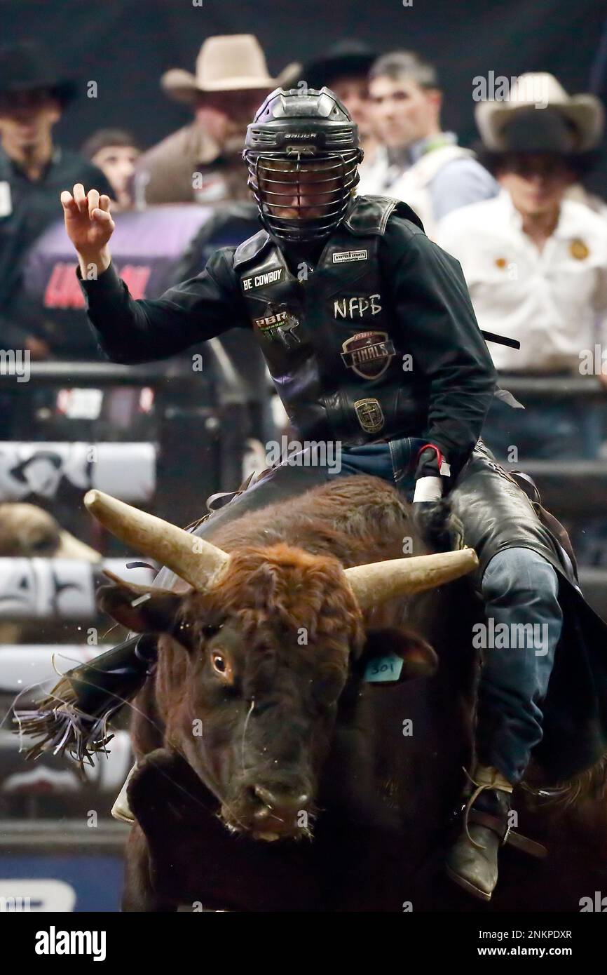 LOS ANGELES, CA - FEBRUARY 22: Bob Mitchell rides bull Redginator ...