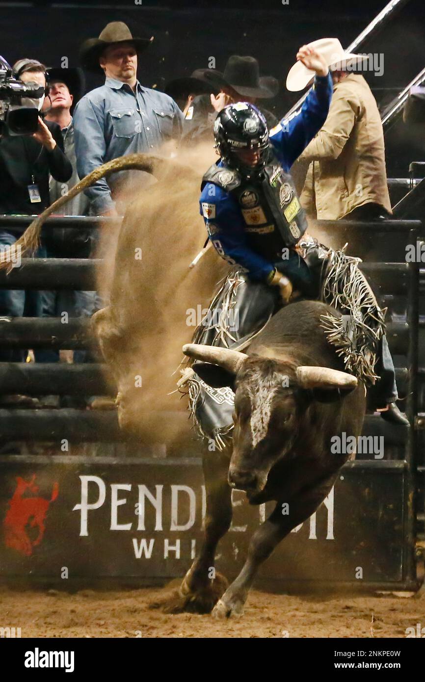 LOS ANGELES, CA - FEBRUARY 22: Mason Taylor rides bull Young Man's ...