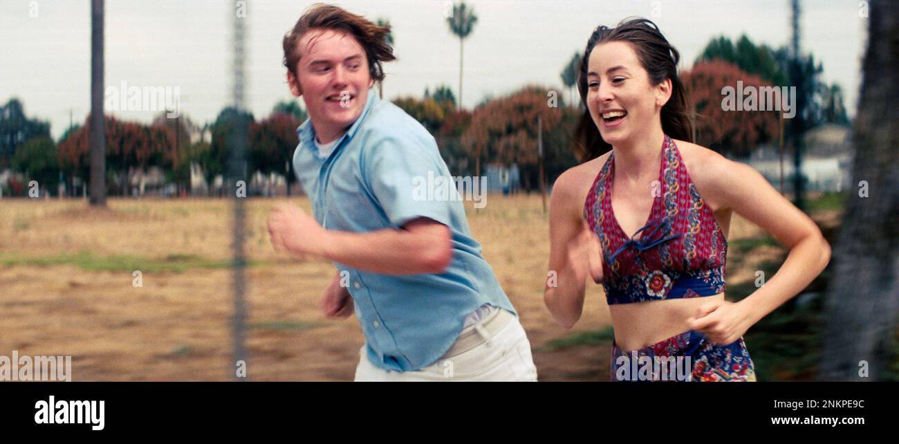 This image released by MGM shows Cooper Hoffman, left, and Alana Haim ...