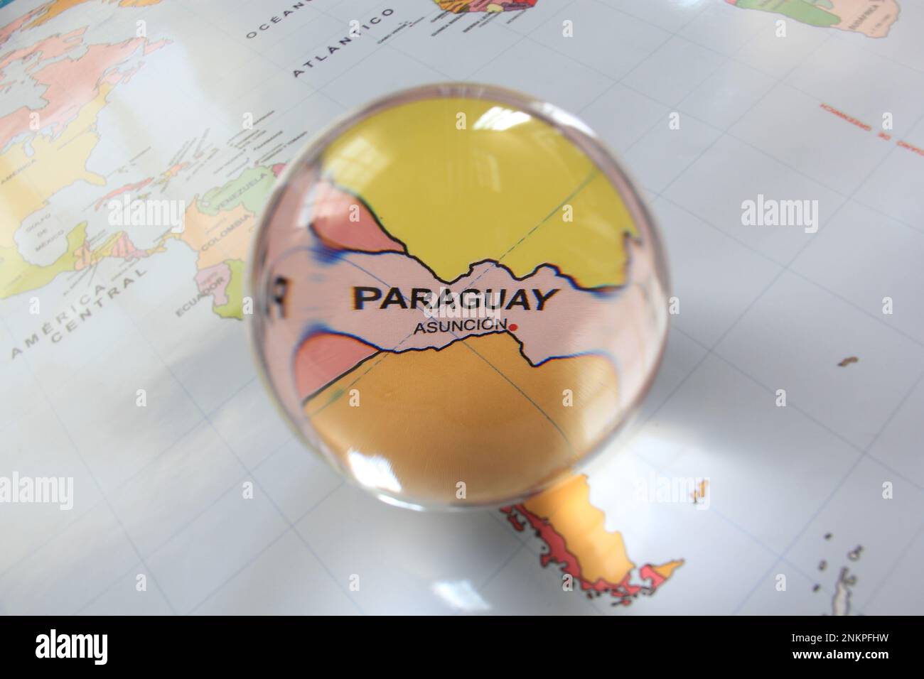 Crystal ball on a world map that highlights a country to highlight it ...