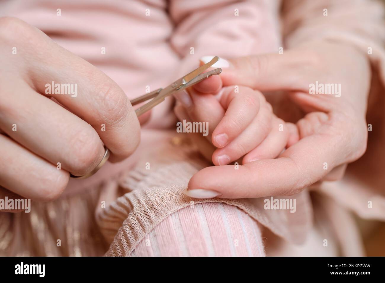 Caring mother cut her child's nails at home Stock Photo - Alamy