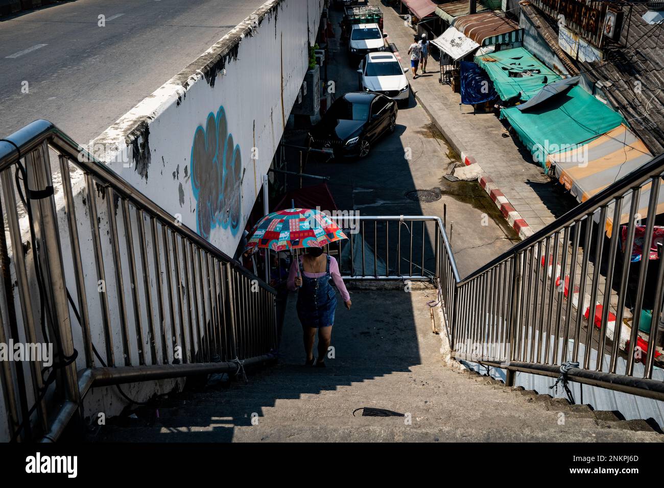 Lad Krabang, Thailand, 24/02/2023, Someone with an umbrella to block ...