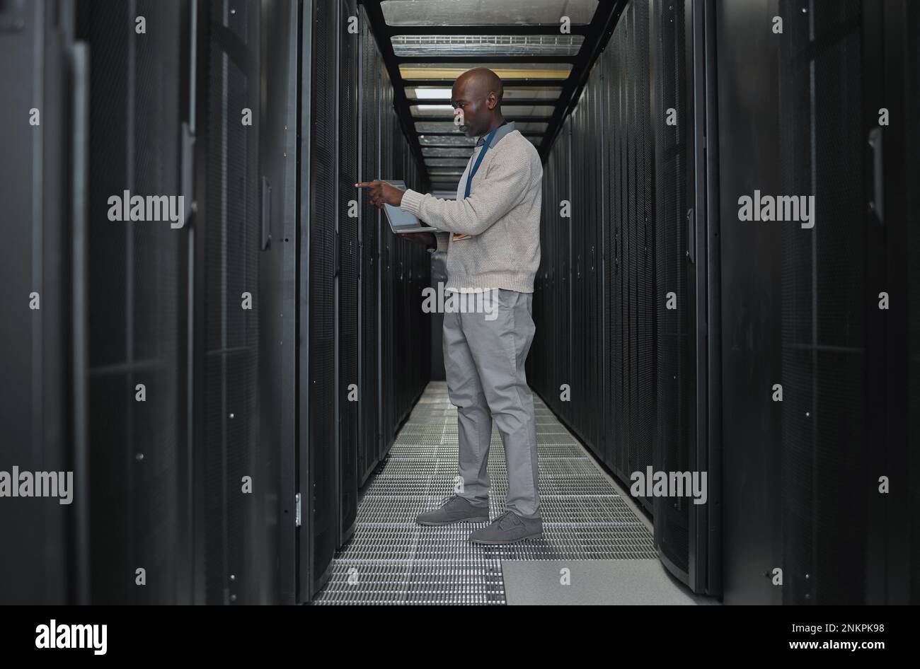 Laptop, maintenance and server room with IT black man for research ...