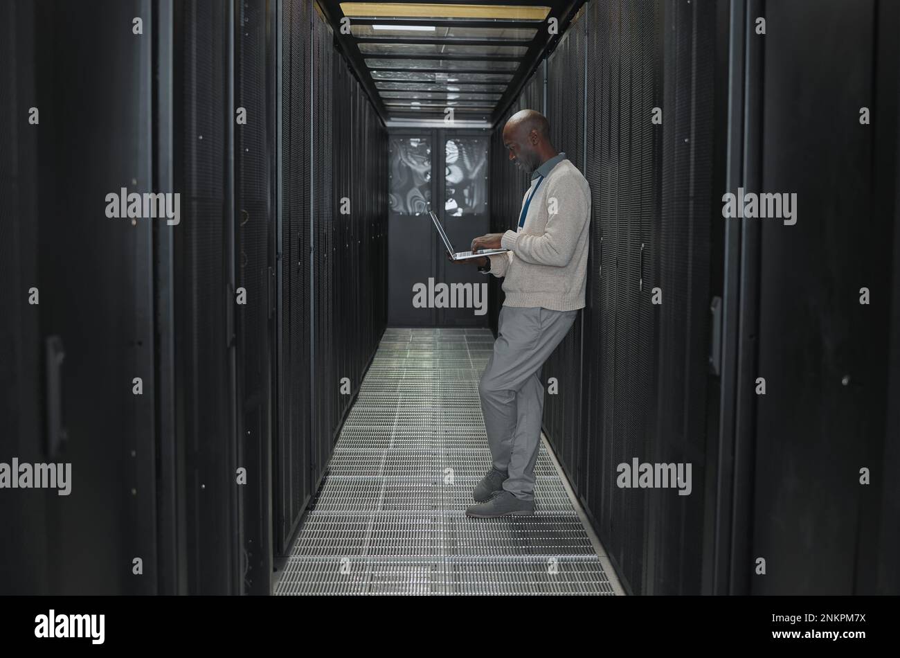 Laptop, network and data center with IT black man for research ...