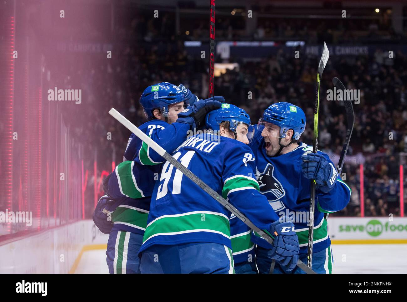 From left to right, Vancouver Canucks' Travis Hamonic, Juho Lammikko ...