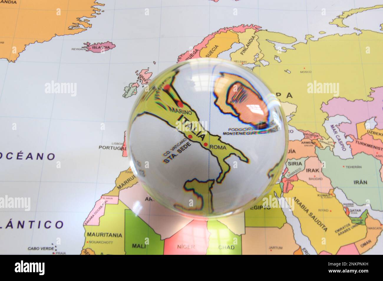 Crystal ball on a world map that highlights a country to highlight it ...