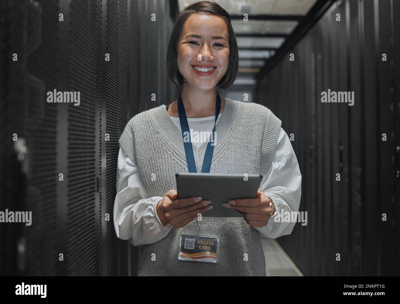 Asian woman, portrait smile and tablet of technician in server room for ...