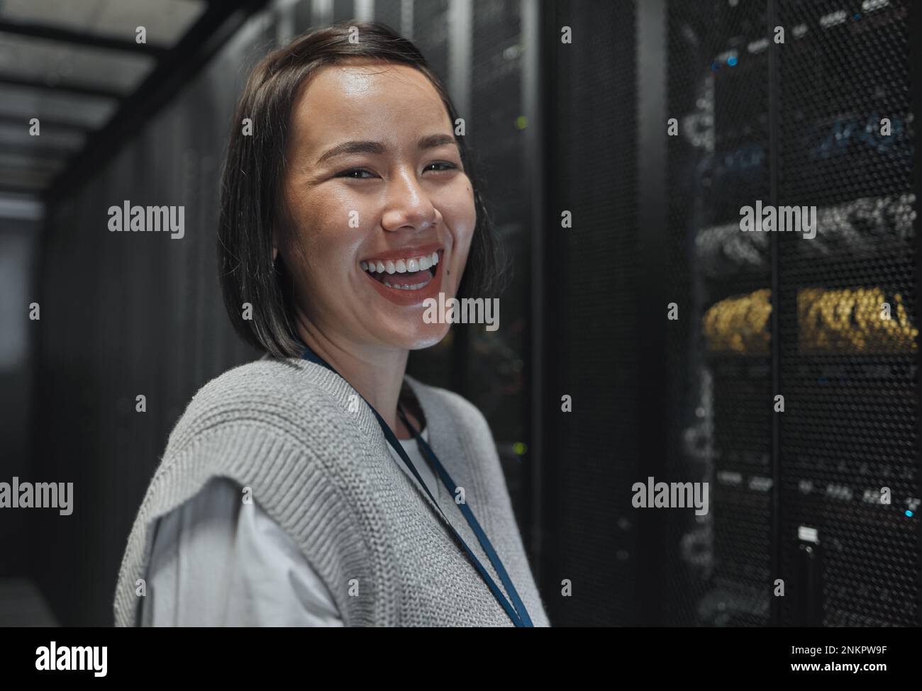 Woman, portrait and happy in server room with information technology ...