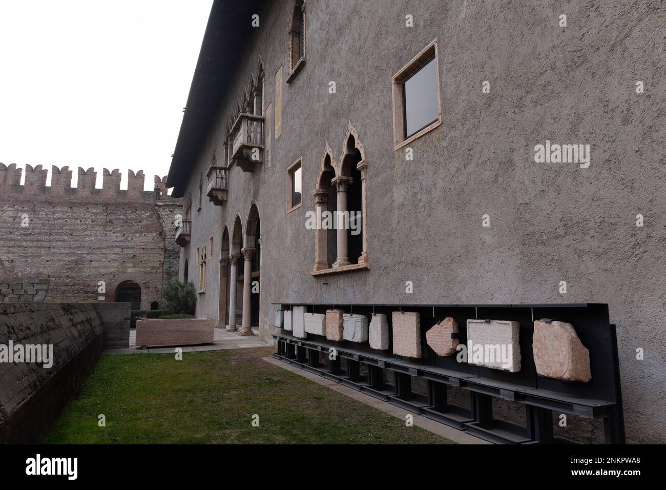 Wider view of Castelvecchio Museum facade with display of ancient stone ...