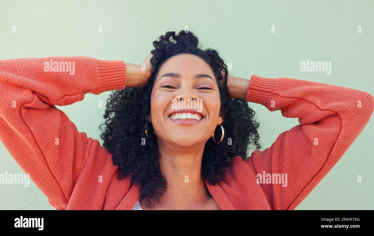 Freedom, hair and fun with a young woman playing with her curly ...