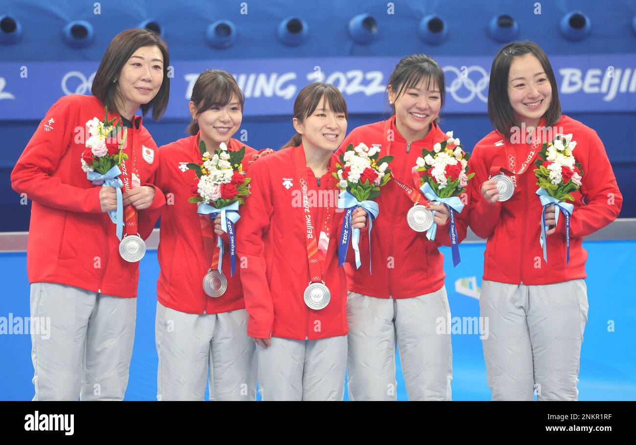 Japan team members pose with the silver medal during the victory ...