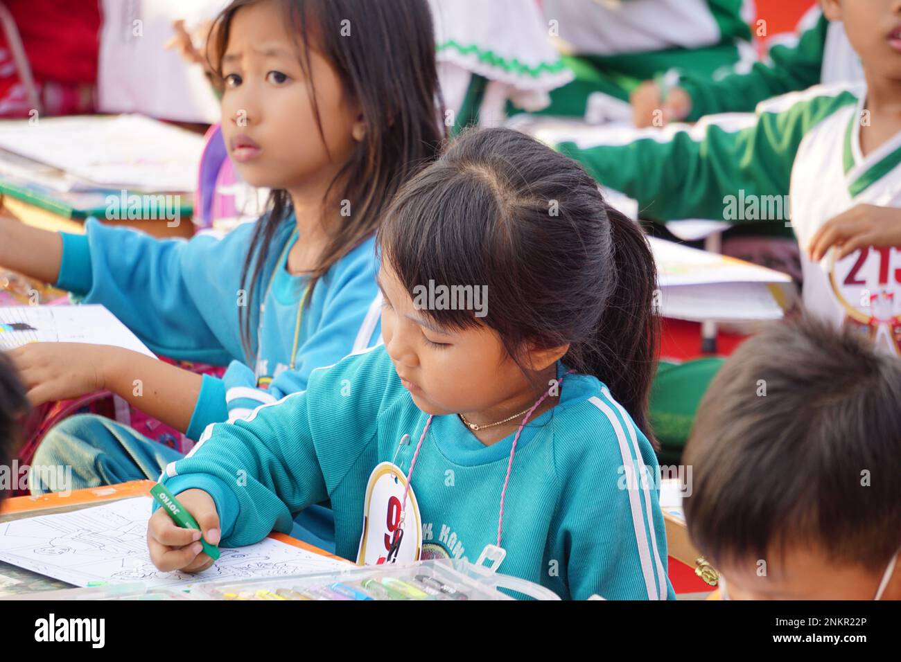Kindergarten students are drawing together Stock Photo - Alamy