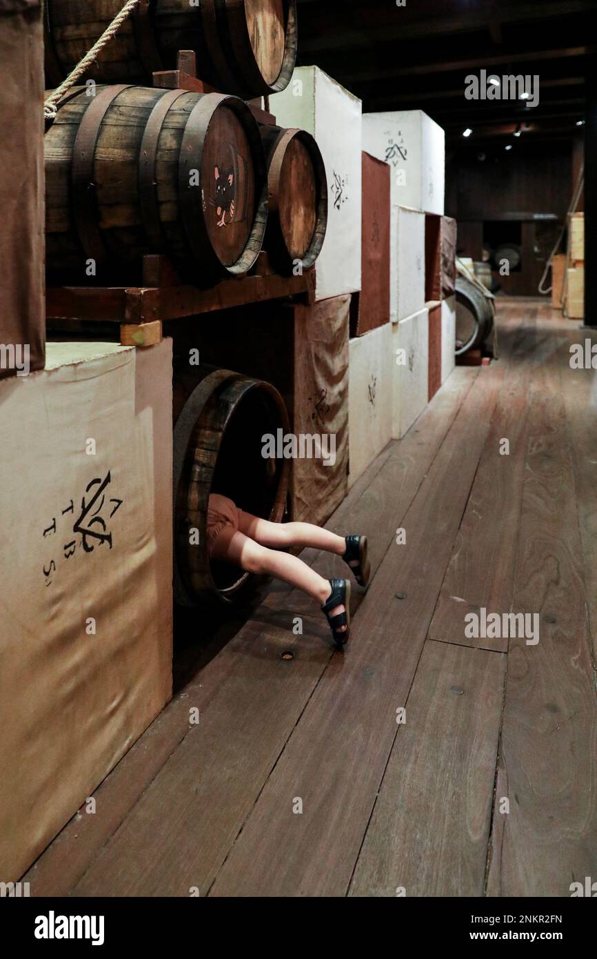 Child's legs sticking out from wooden barrel Stock Photo - Alamy
