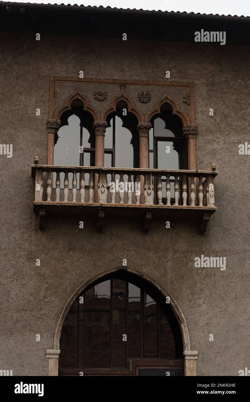 Beautiful gothic style window with stone balcony at Castelvecchio ...