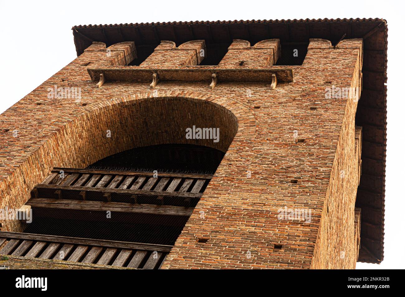 View looking up at Castelvecchio bridge/castle architecture. Stone arch ...