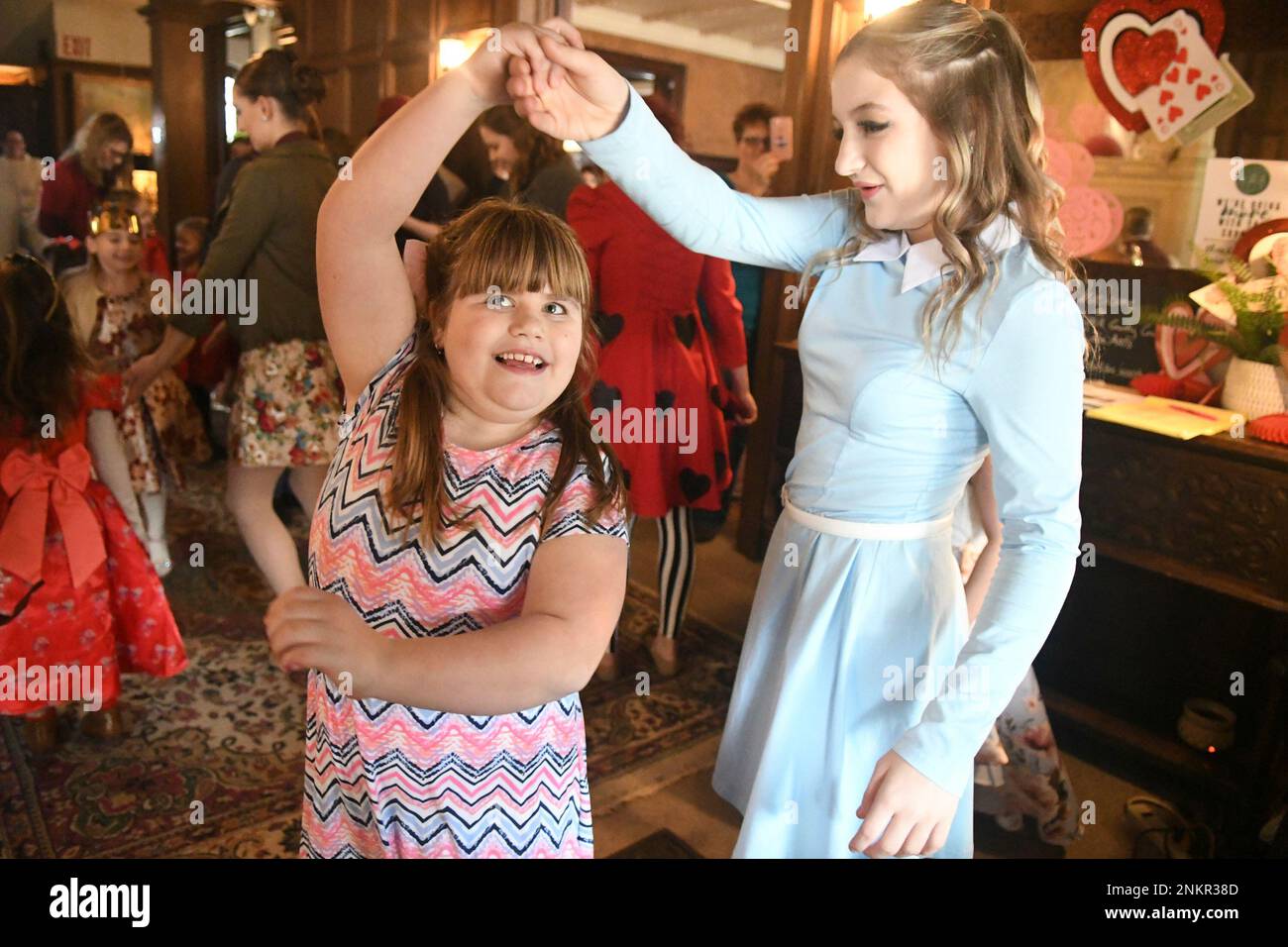 Paige Botek, 7, of Saint Clair, Pa., dances with Grace Lapachinsky, of ...