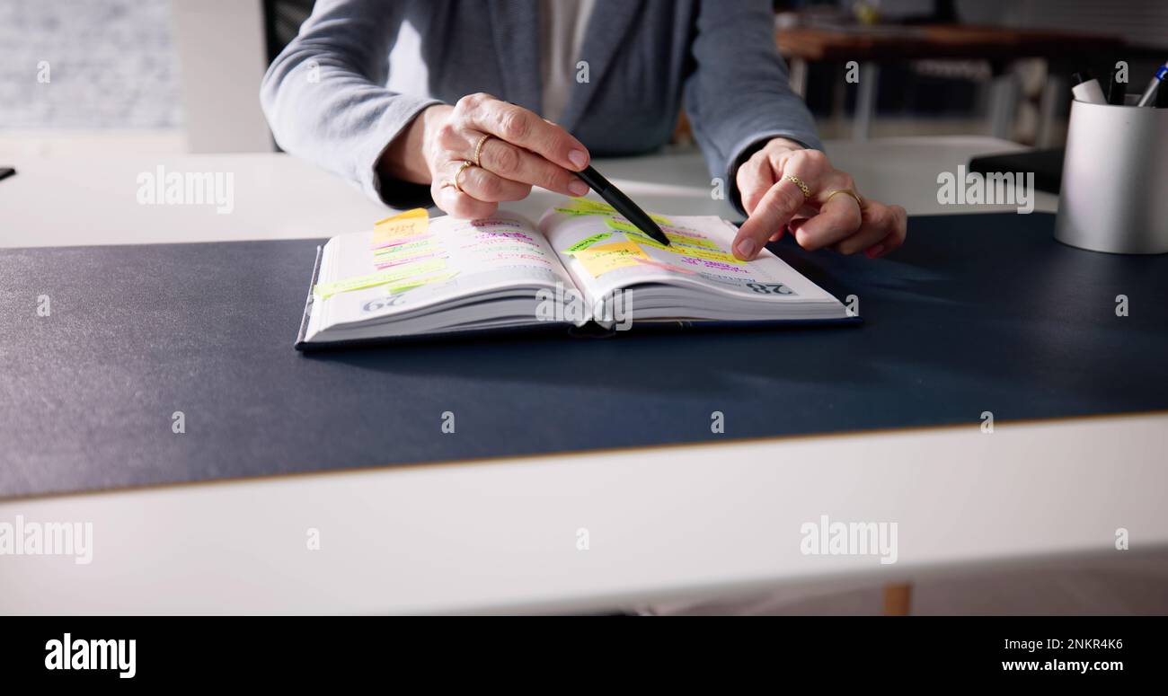 Woman working desk schedule hi-res stock photography and images - Alamy