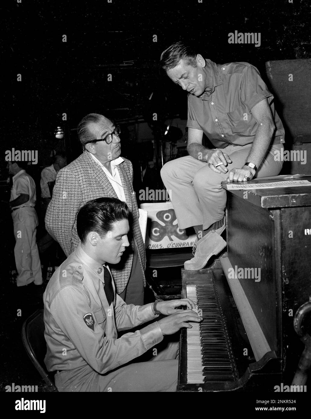 Elvis playing the piano, photographed during the G.I. Blues soundtrack ...