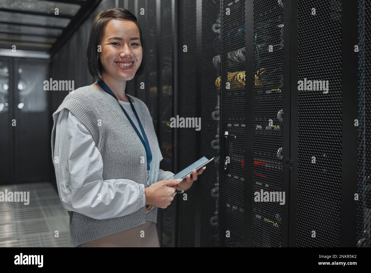 Asian woman, portrait and tablet of technician by server for networking ...