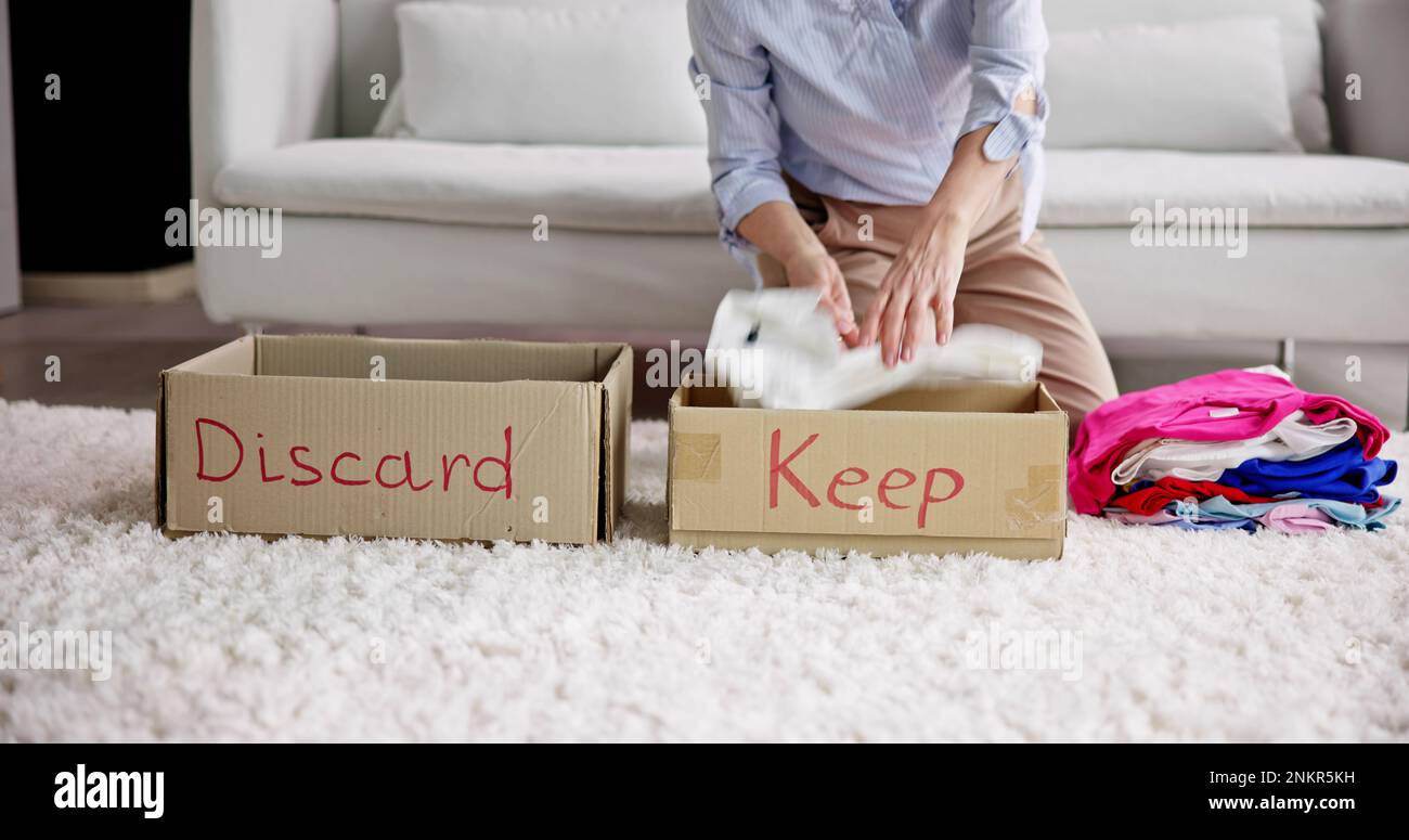 Closet Declutter And Cleaning. Organized Woman Discarding Clothes Stock ...