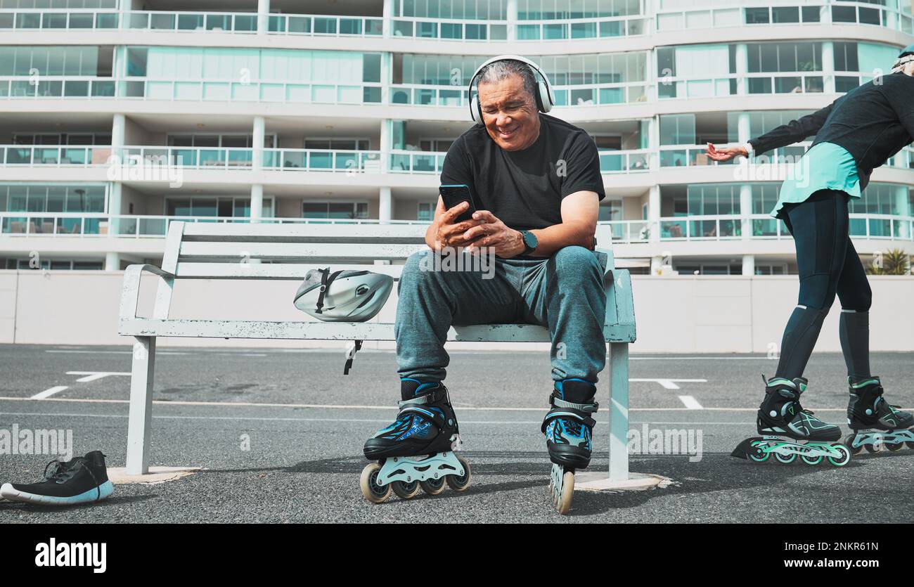 Fitness, roller blade and senior man with smartphone, smile and guy on ...