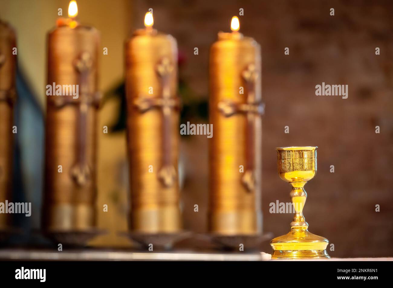 interiors and details in catholic church view of the altar, candles and ...
